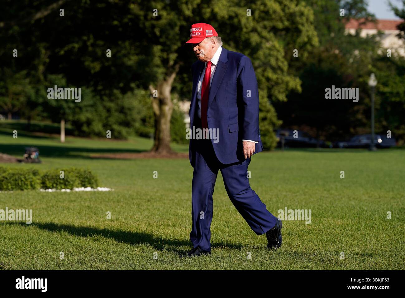 President Donald Trump walks on the South Lawn upon arriving at the ...