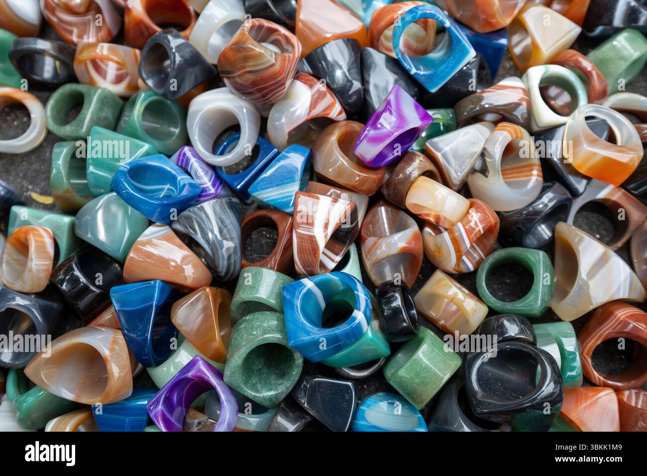 Assortment of colorful resin rings for sale at fashion fair Stock Photo ...