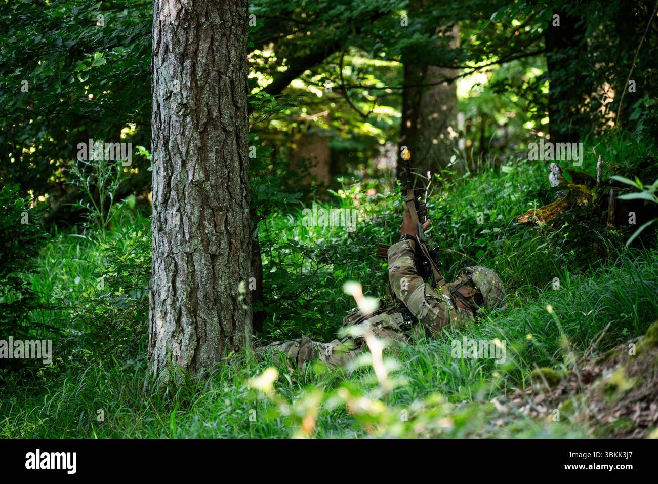A U.S. Soldier assigned to 3rd Squadron, 2nd Cavalry Regiment aims at a ...