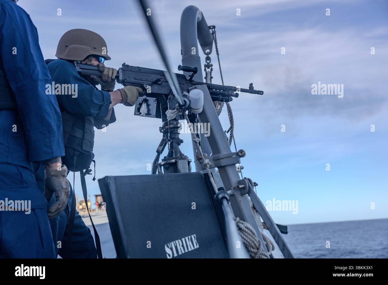 Gunner’s Mate 1st Class Dillon Lee from Sacramento, California, fires ...