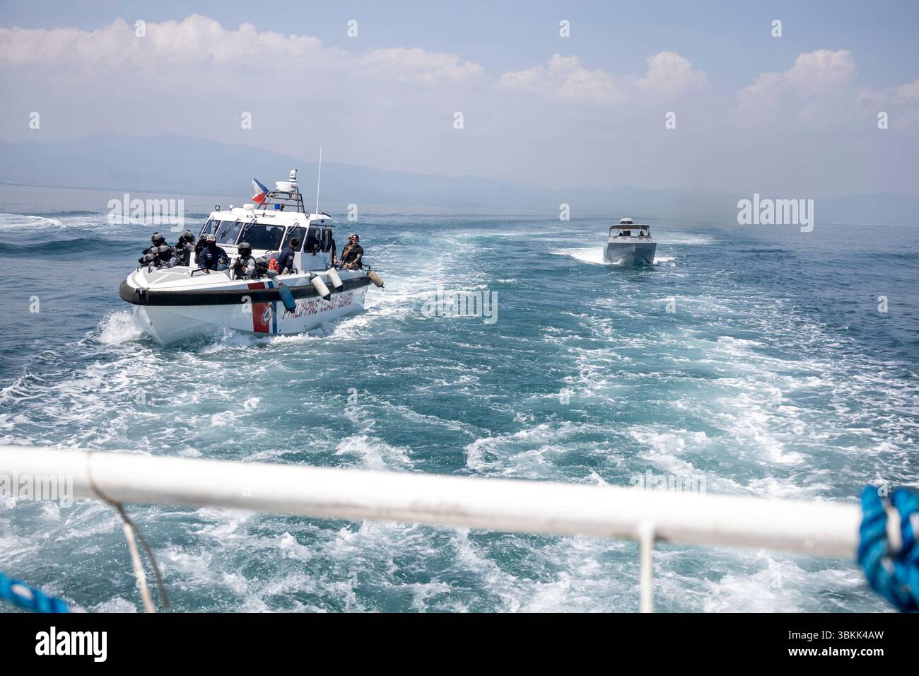 U.S. Naval Special Warfare operators and Philippine Coast Guard service ...