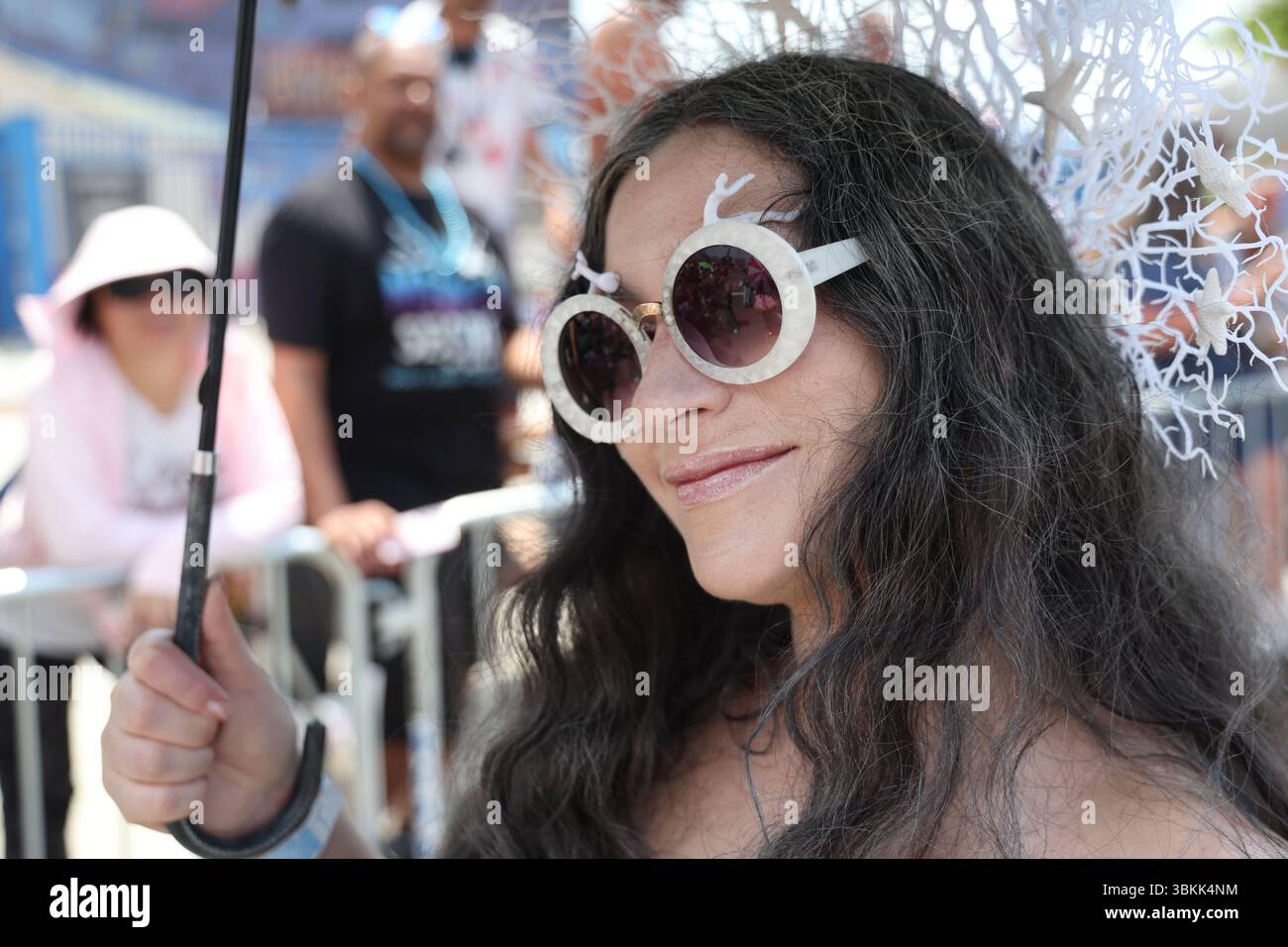 People dressed as mermaids and sea creatures participate in the 43rd ...