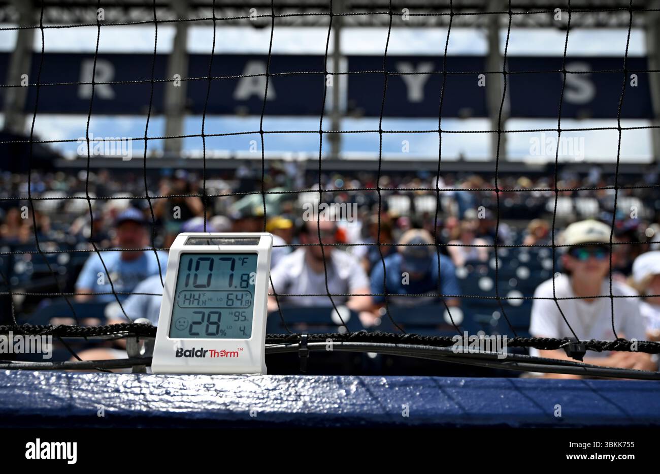 A thermometer on top of the Tampa Bay Rays' dugout shows 107.8 degrees ...