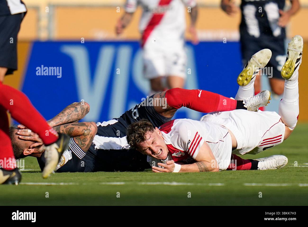 River Plate's Marcos Acuna, right, and Monterrey's Sergio Ramos fall ...