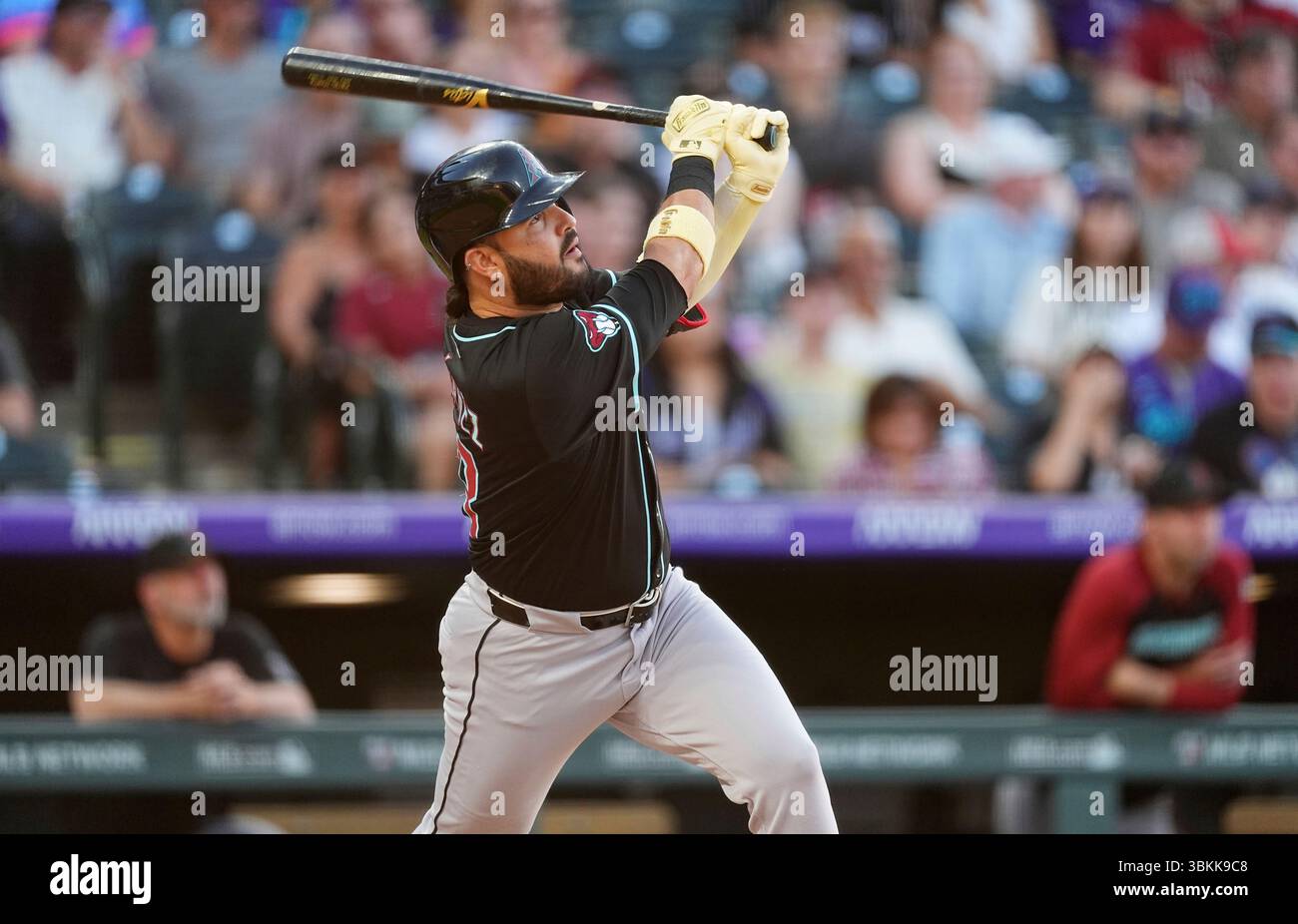 Arizona Diamondbacks' Eugenio Suárez follows the flight of his solo ...