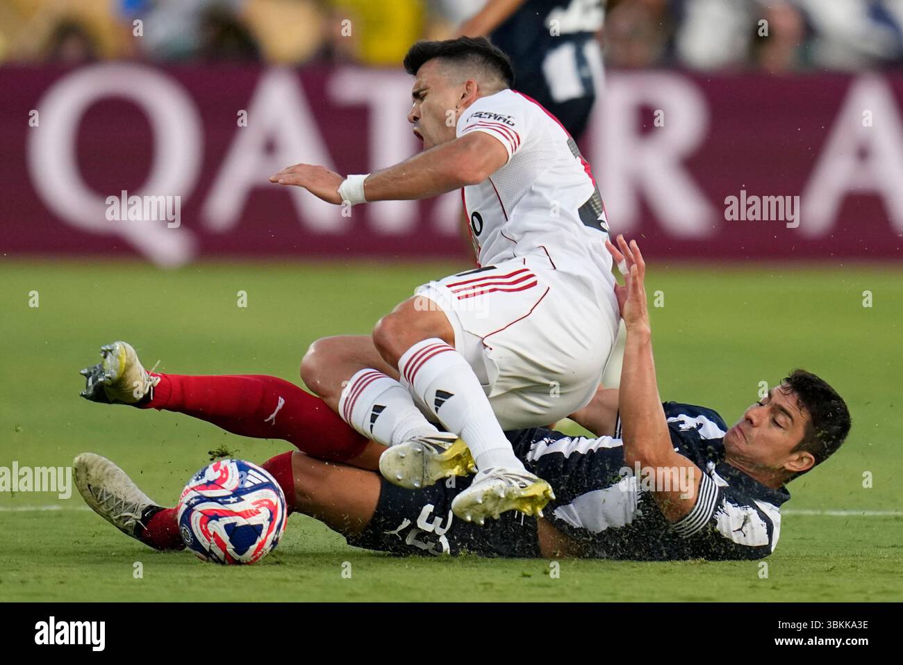 River Plate's Marcos Acuna, front, is tackled by Monterrey's Stefan ...