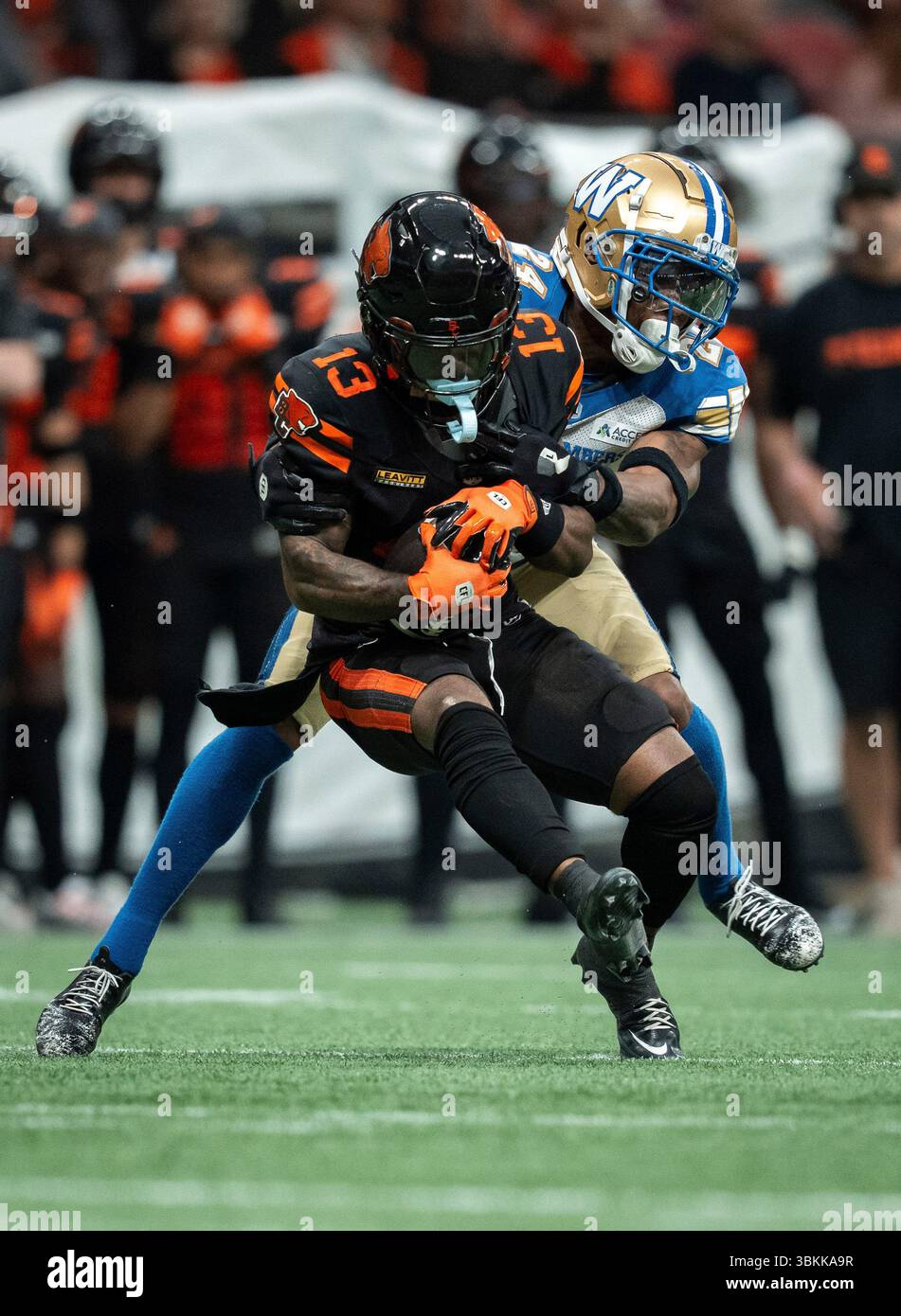 Winnipeg Blue Bombers' Terrell Bonds (24) tackles B.C. Lions' Jermaine ...