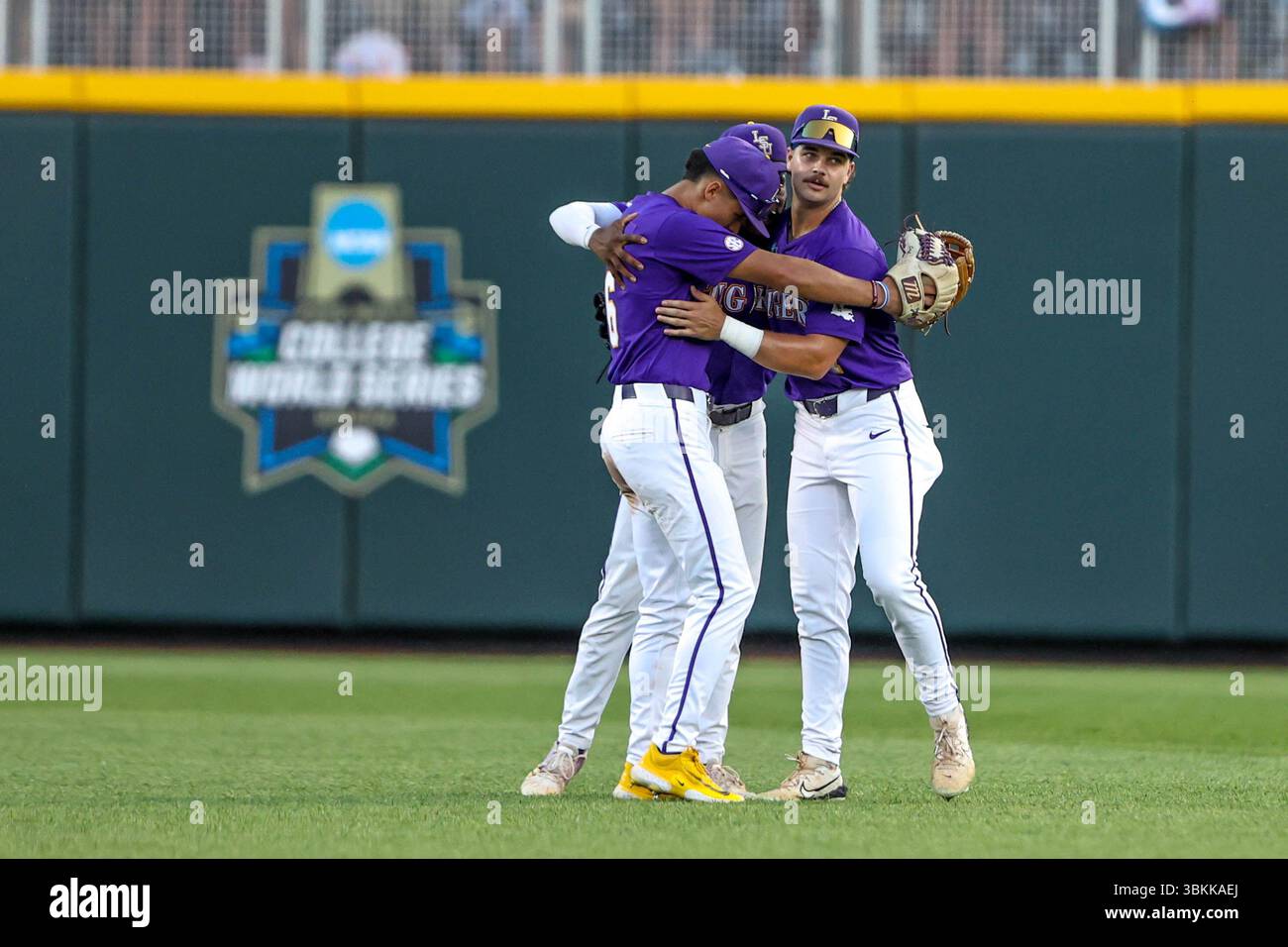 Omaha, NE, USA. 21st June, 2025. LSU outfielders Jake Brown (7), Derek ...