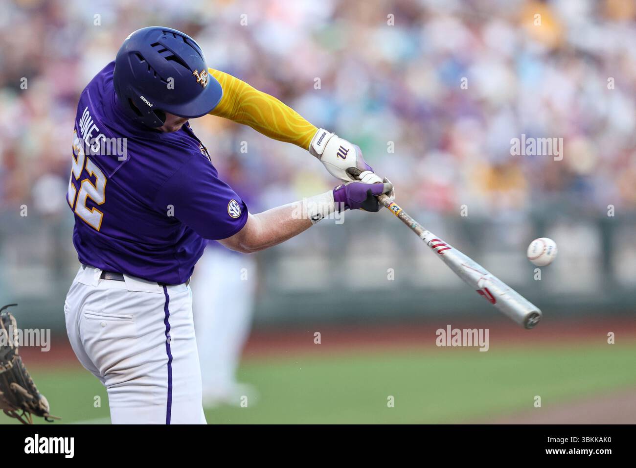 Omaha, NE, USA. 21st June, 2025. LSU's Jared Jones (22) tries for a hit ...