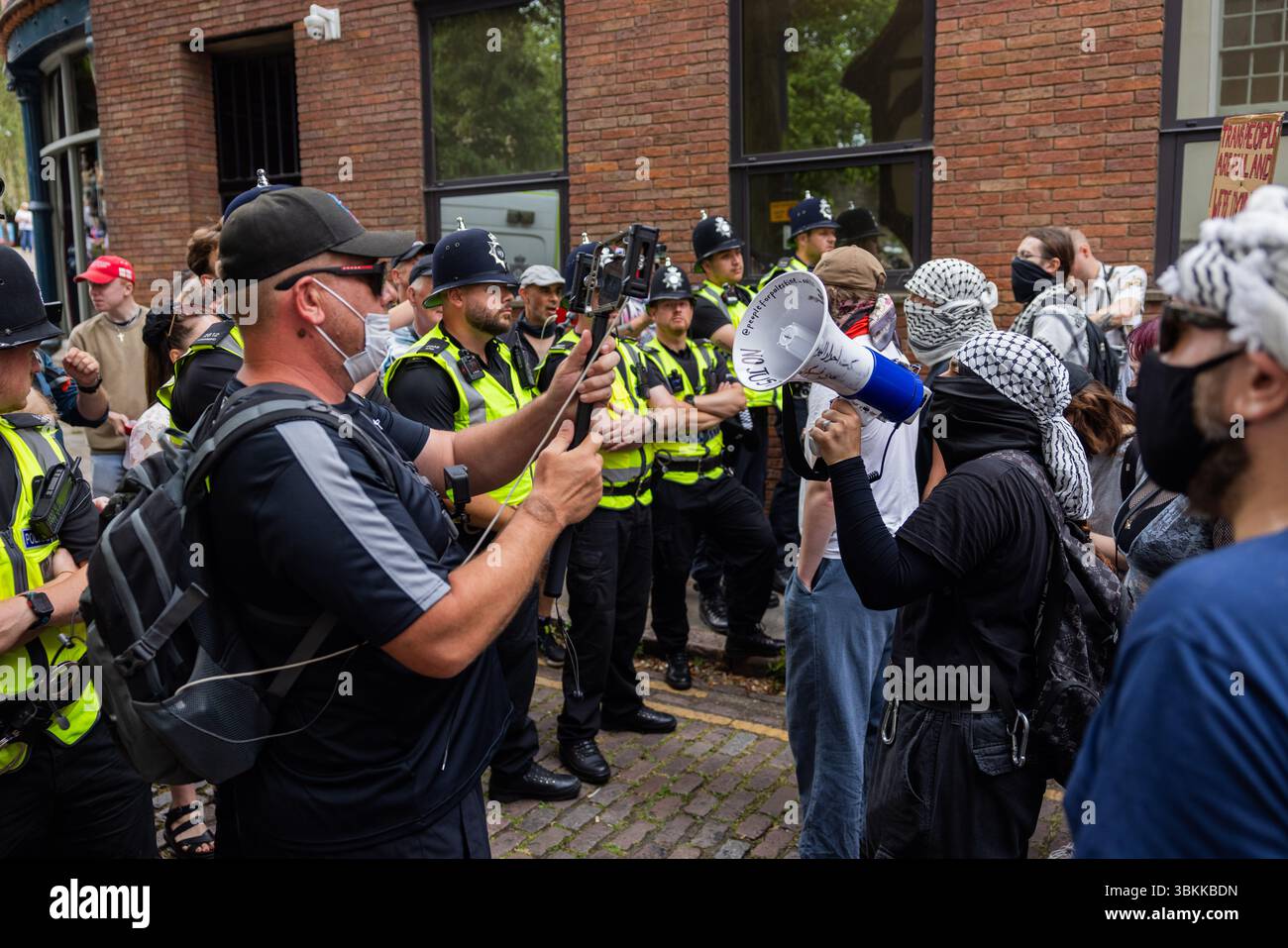 Nottingham, UK. 21 JUN, 2025. Counter protestors attempt to get to UKIP ...