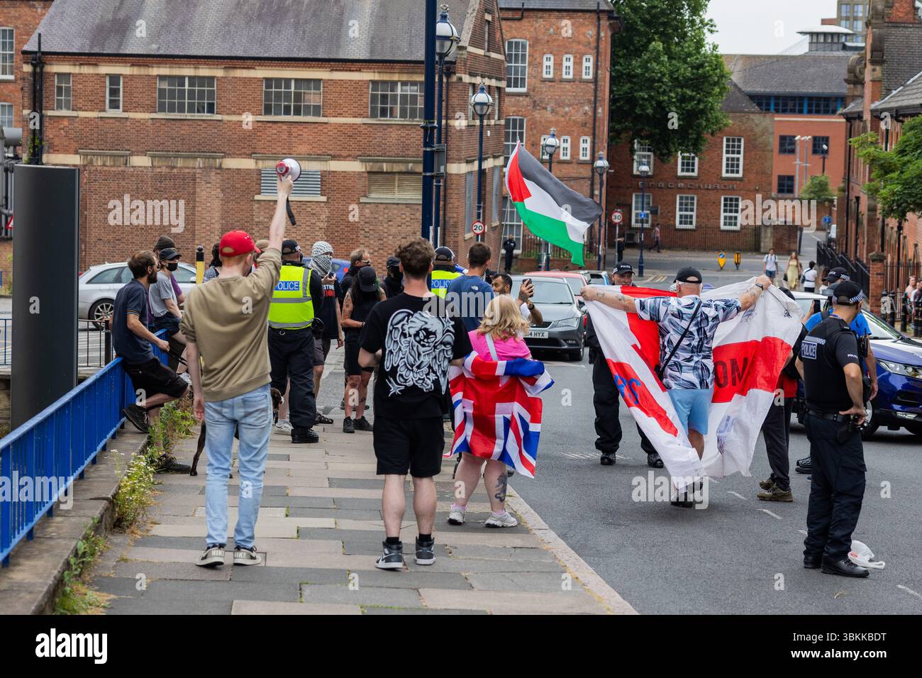Nottingham, UK. 21 JUN, 2025. Counter protestors attempt to get to UKIP ...