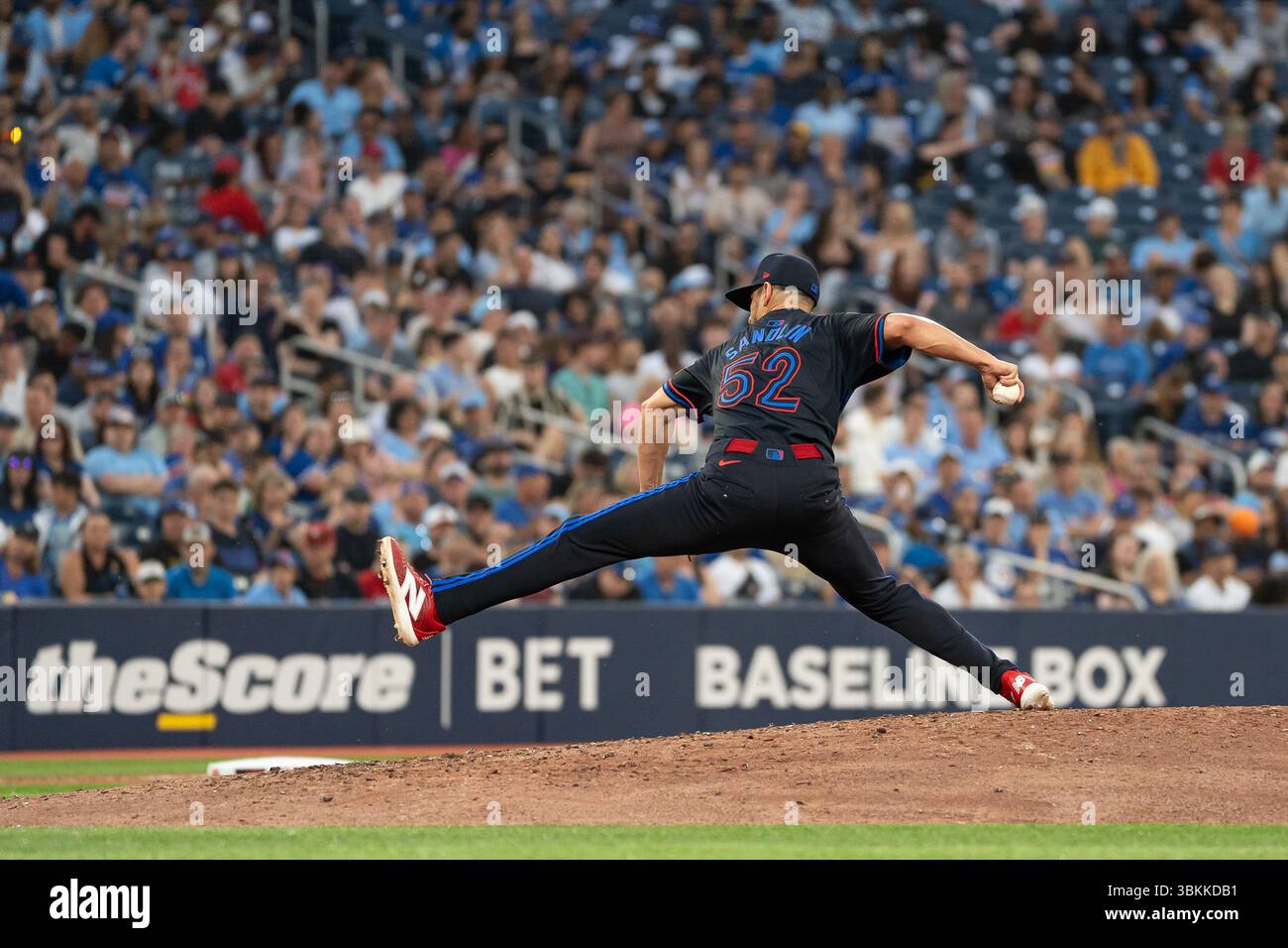 Nick Sandlin #52 of Toronto Blue Jays pitches the ball against White ...