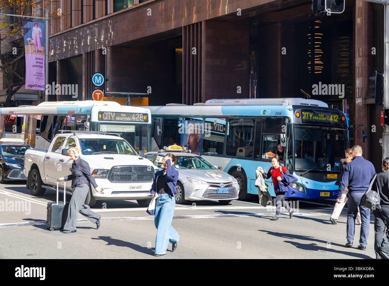Sydney city centre, people crossing the road on red traffic lights in ...