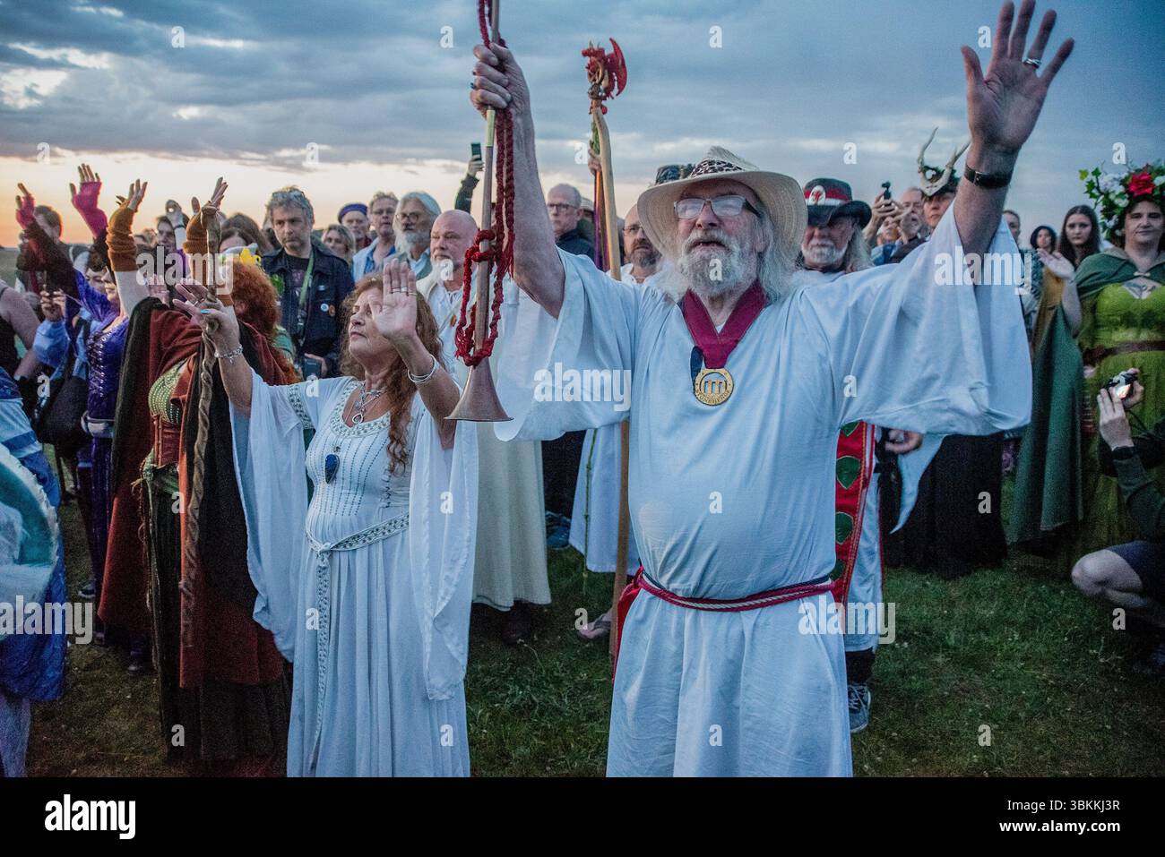 Stonehenge, UK. 21st June, 2025. The druids pray together during the ...