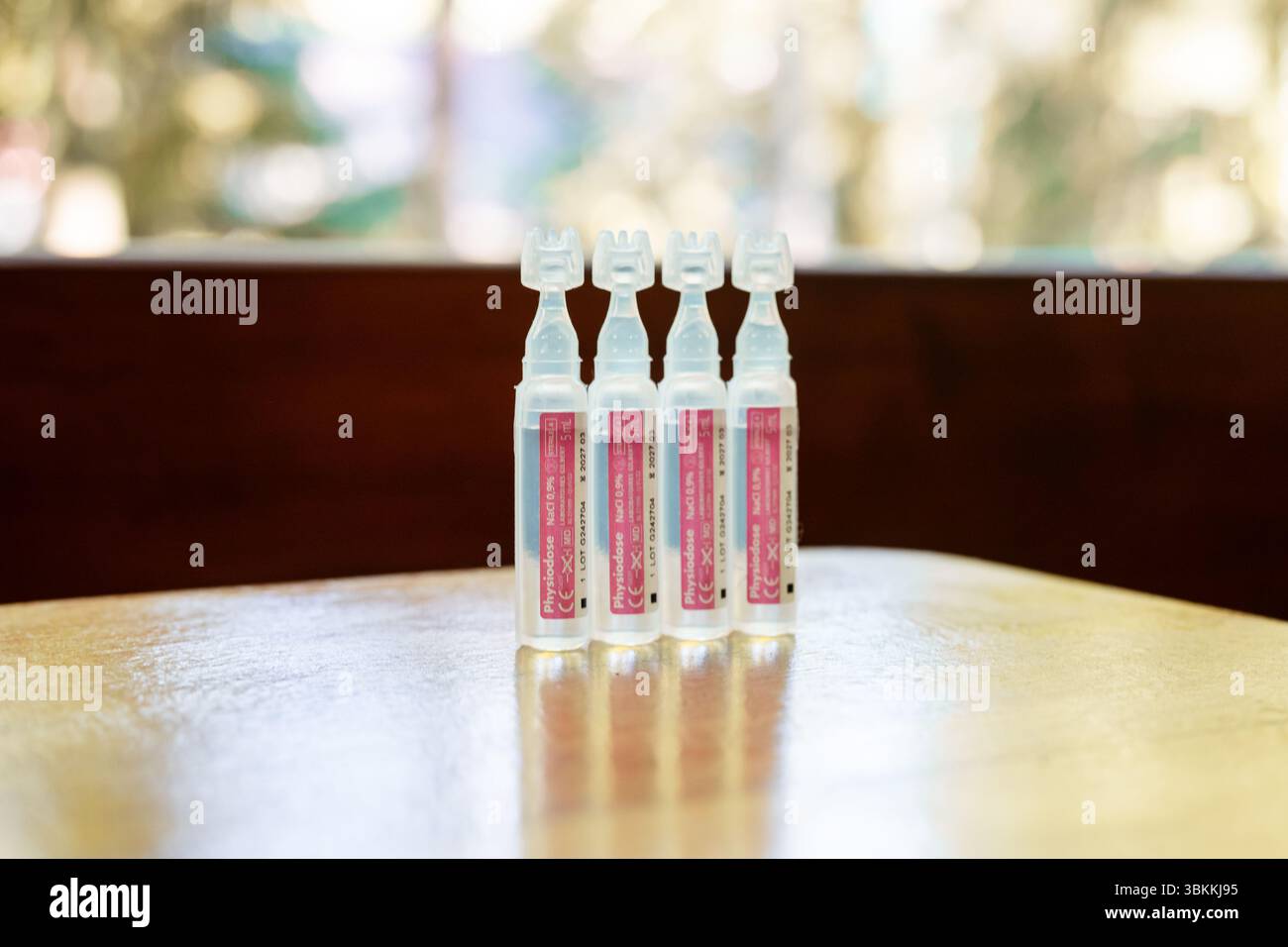 Lublin, Poland 21 June 2025 set of small sterile bottles of saline NaCl ...