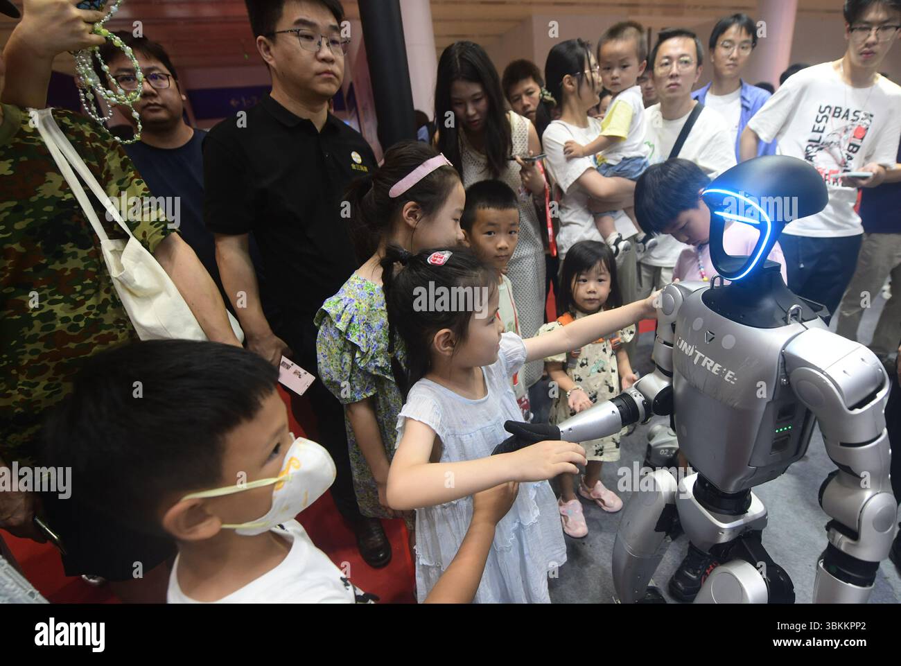 HANGZHOU, CHINA - JUNE 22, 2025 - A young visitor interacted with ...