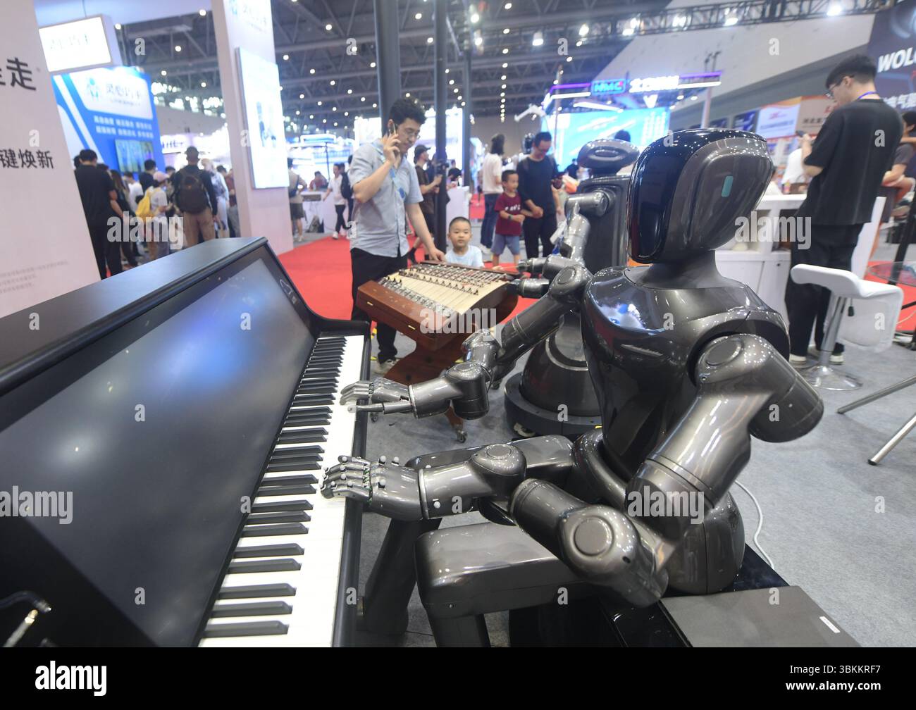 HANGZHOU, CHINA - JUNE 22, 2025 - A humanoid robot gave a piano ...