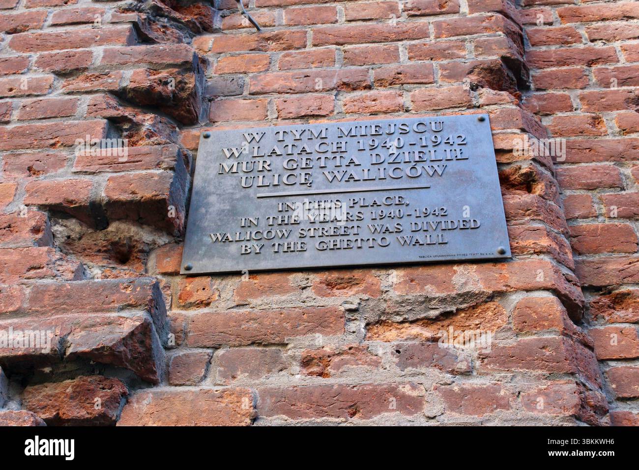 the preserved wall of the warsaw ghetto at walicow street standing in ...