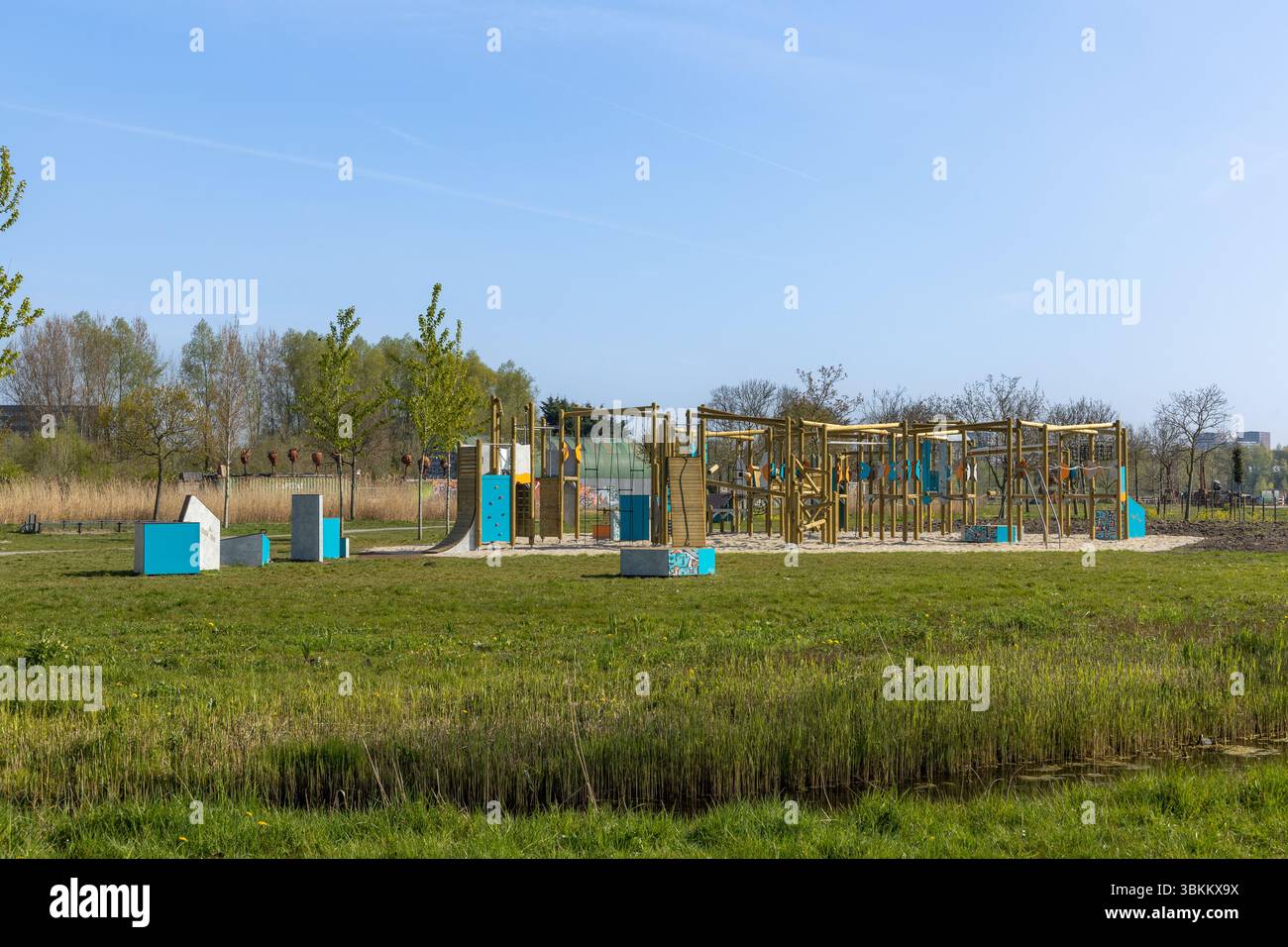 Colorful wooden playground structure with various climbing and play ...