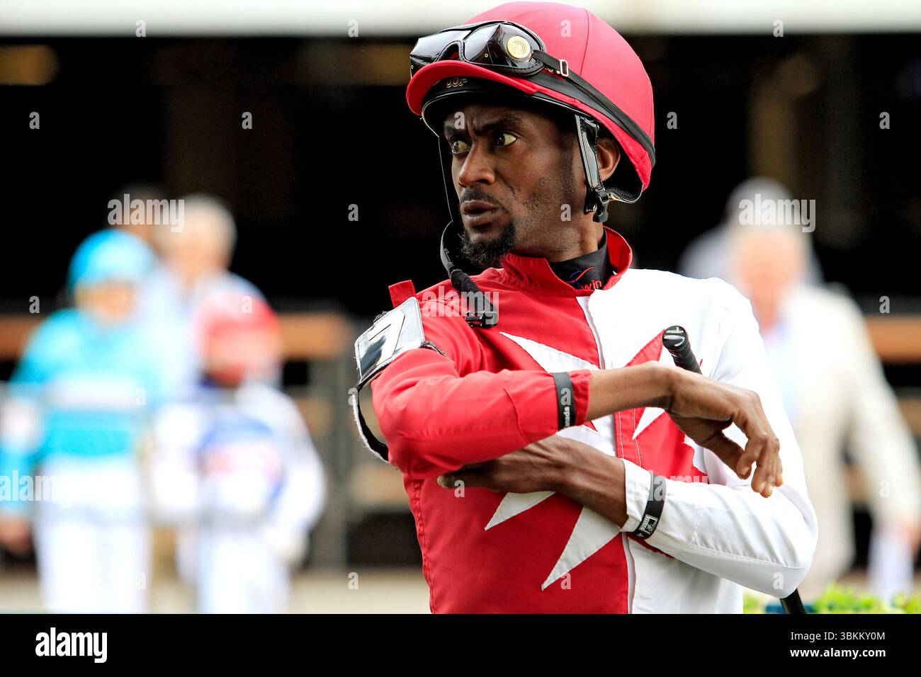 Jockey Jason Hoyte adjusts his armband as he heads to the walking ring ahead of the $100,000 ...