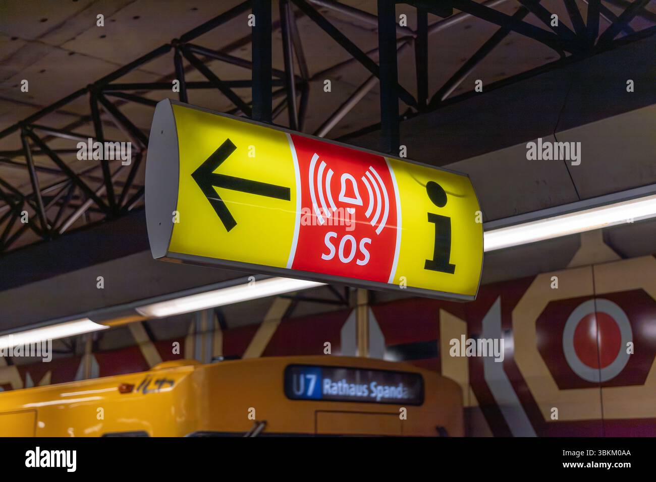 Yellow and red sign indicating the direction of an SOS emergency alarm ...