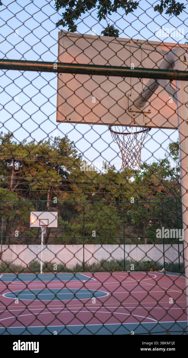 basketball field with metal fence Stock Photo - Alamy