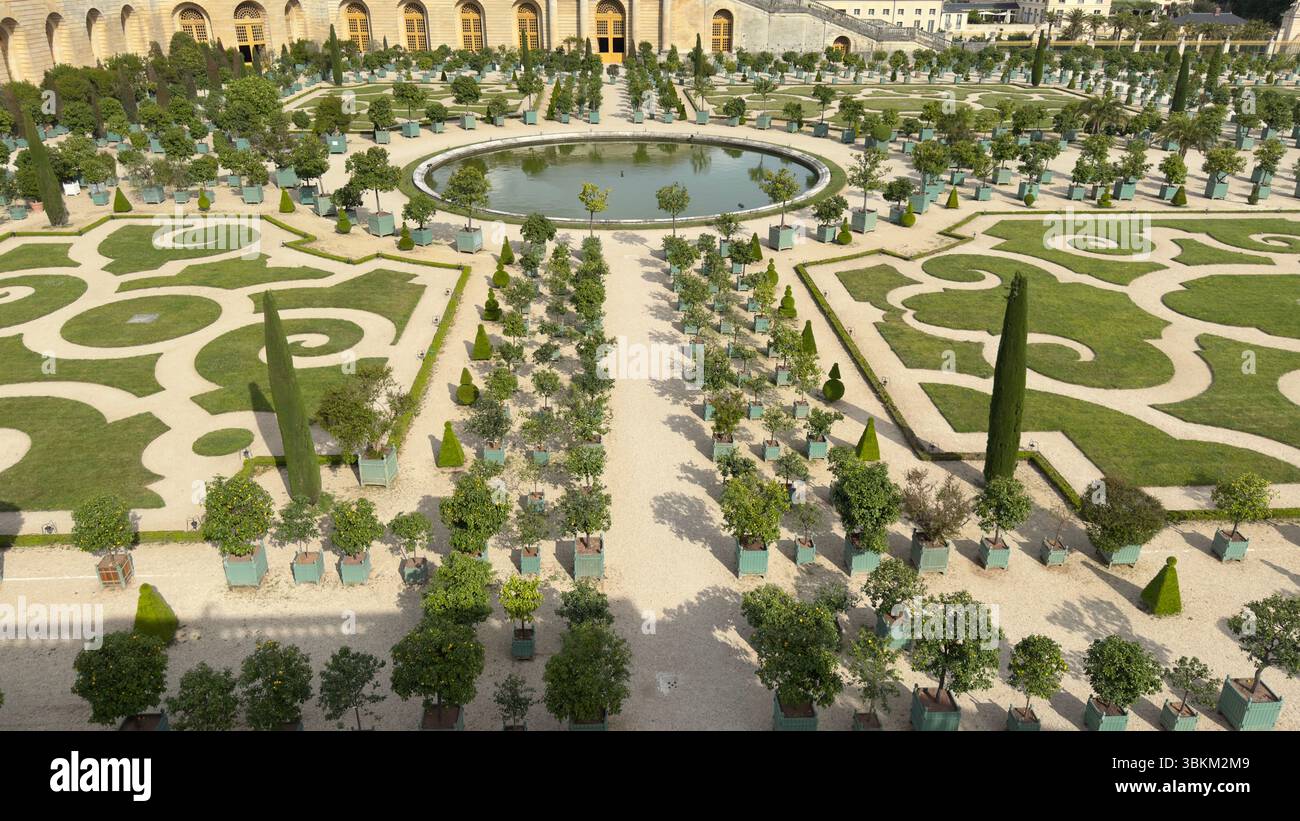 An aerial view of an elaborate formal garden with geometrically ...