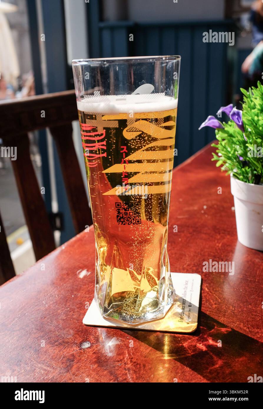 Cambridge UK June 2025 - A pint glass of Asahi lager beer Stock Photo ...