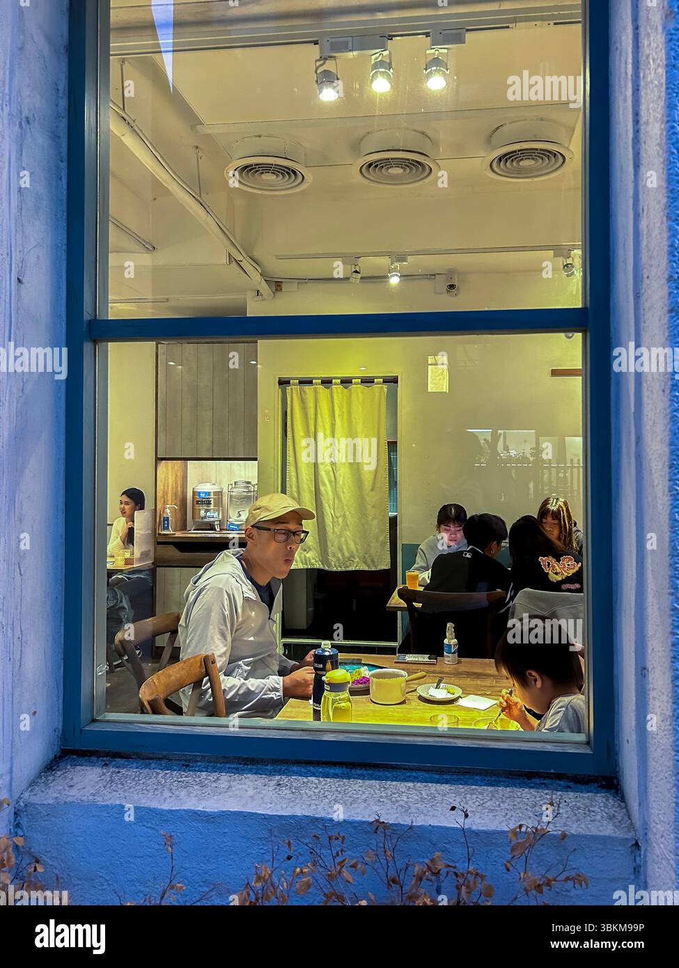 Taipei, Taiwan, View Looking in Window, Taiwanese Family sitting at ...