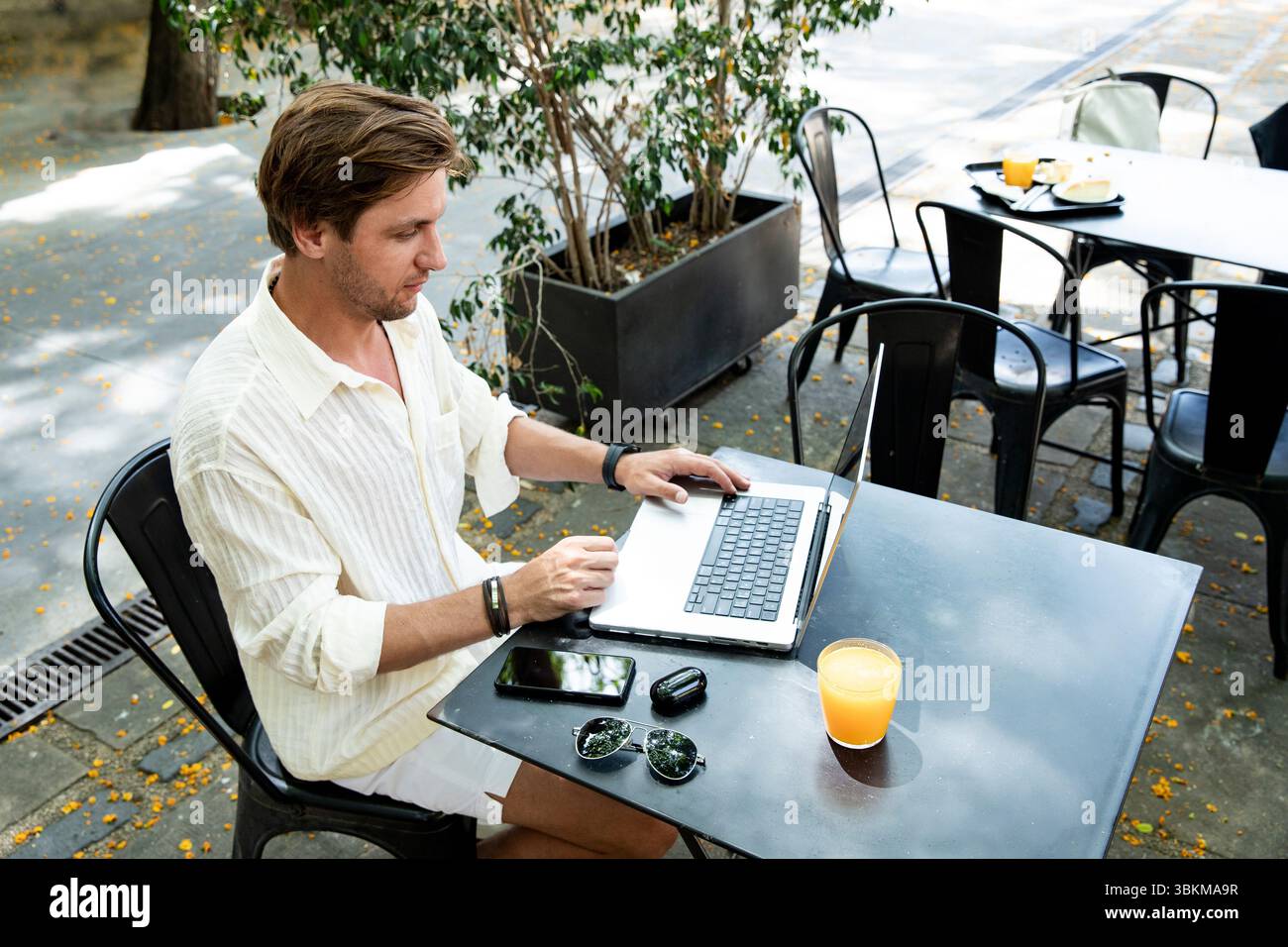 Male freelancer sitting table hi-res stock photography and images - Alamy