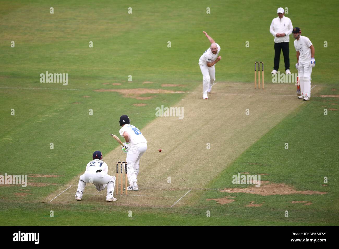 Sussex's Daniel Hughes (left) in action as Durham's Ben Raine bowls ...