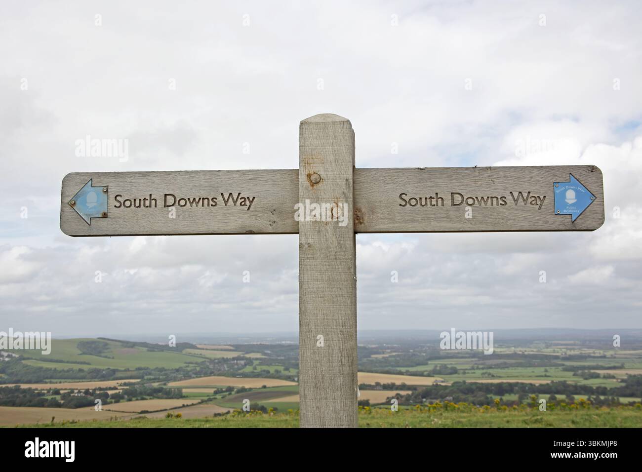 signs pointing the direction of the south downs way at firle in east ...