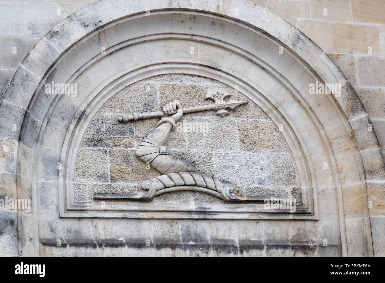 The symbol ‘Arm with Axe’ (‘Bras Armé’) above the main portal of the ...
