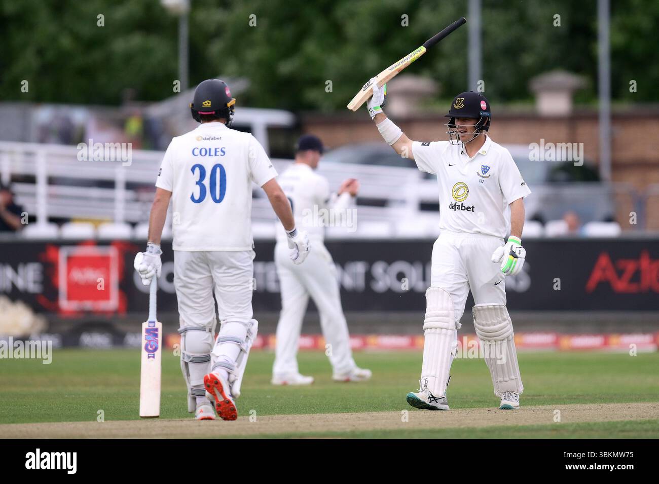 Sussex's Daniel Hughes (right) celebrates reaching 50 runs during day ...
