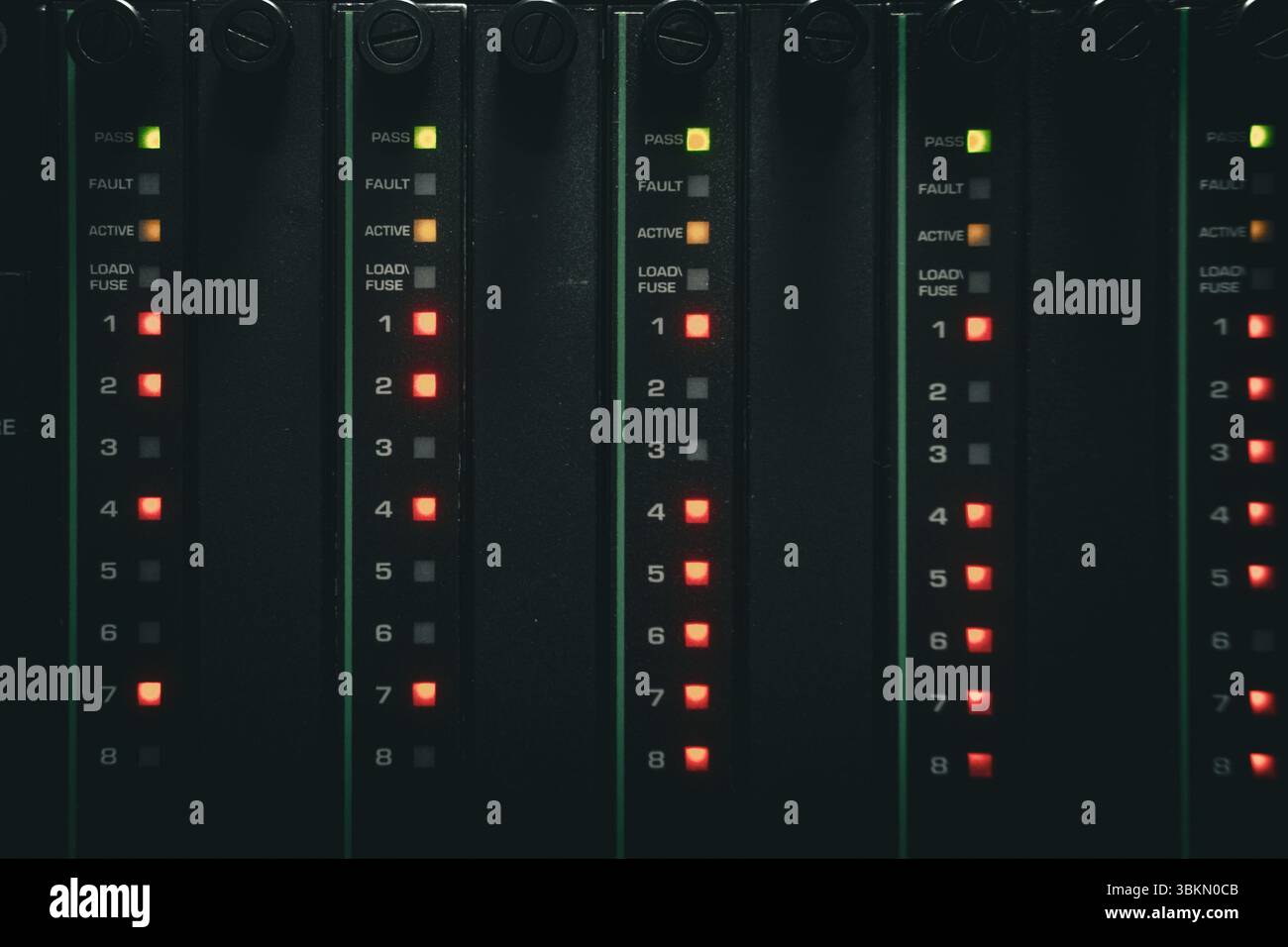 Row of control board with a green light on the top left. The top left ...