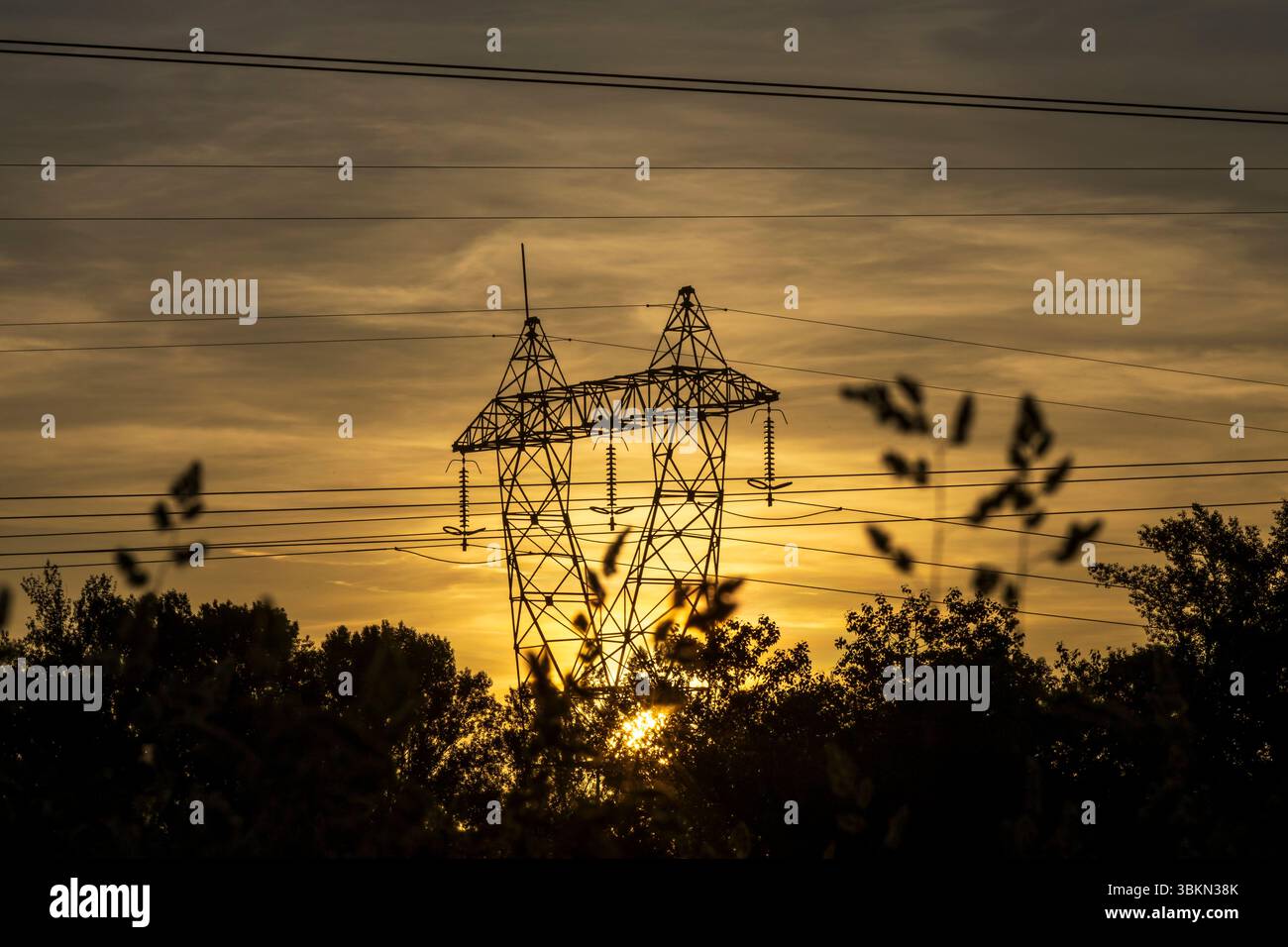 High voltage pylon in the French countryside at sunset. 400 kV High ...
