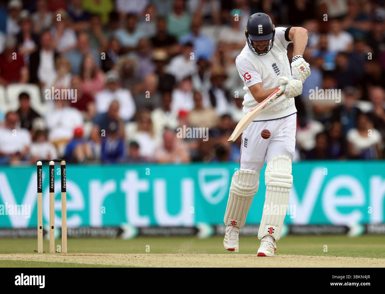 England's Chris Woakes plays a shot during day three of the first ...