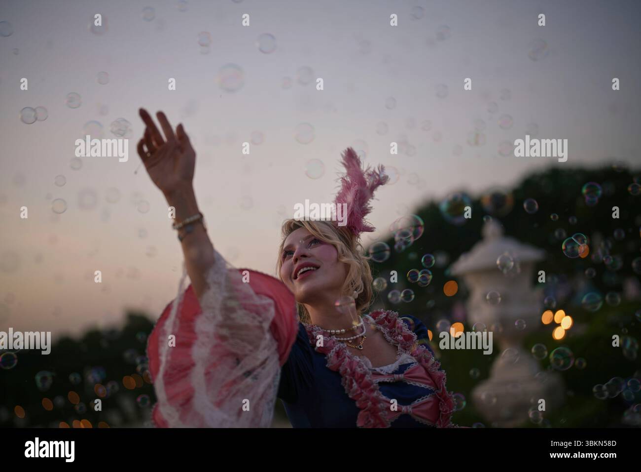 Alexandra of Ukraine poses in the gardens of the Versailles castle ...