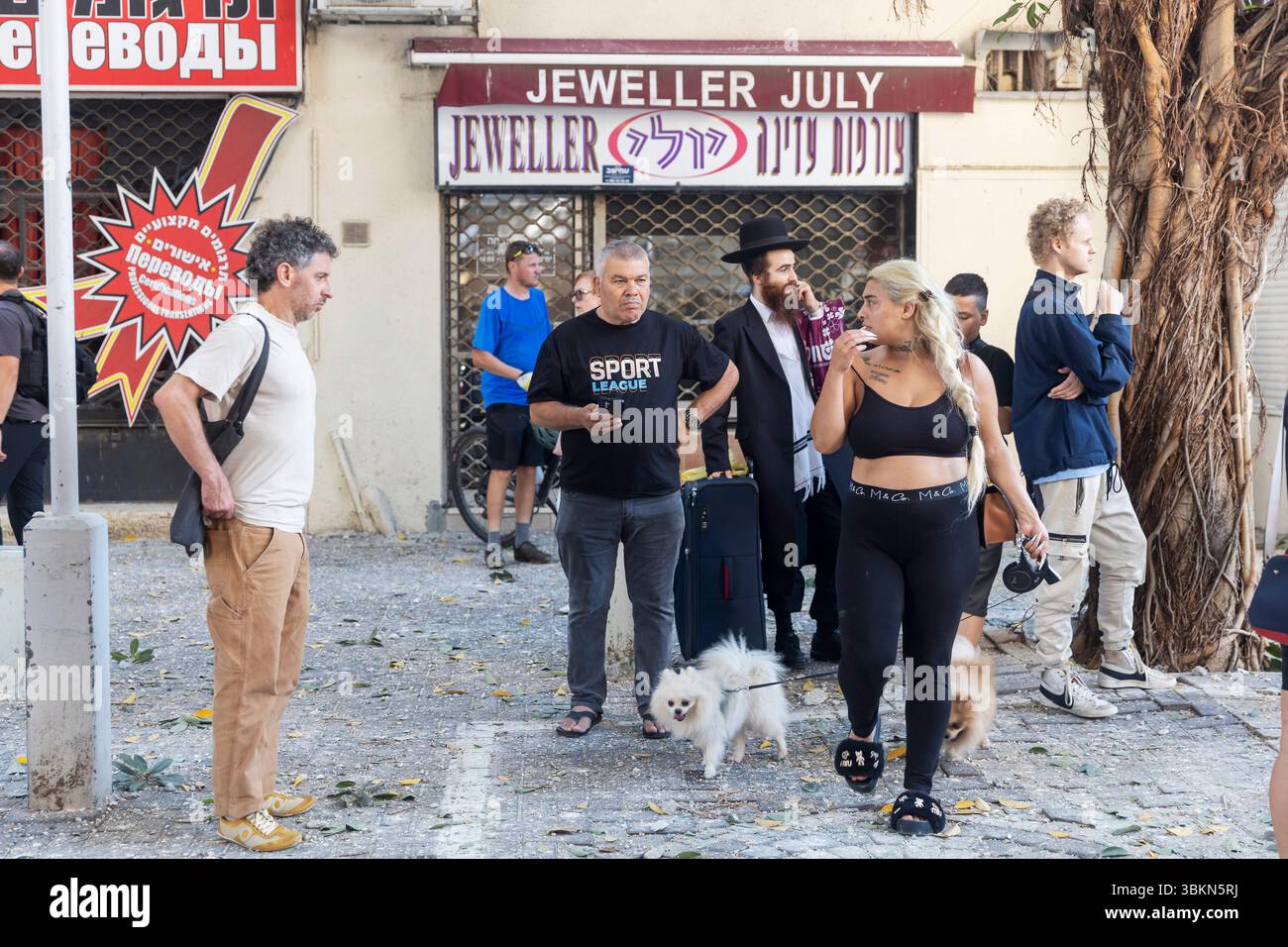 Haifa, Israel, 22 June 2025 People watch as the rubble is cleared away ...