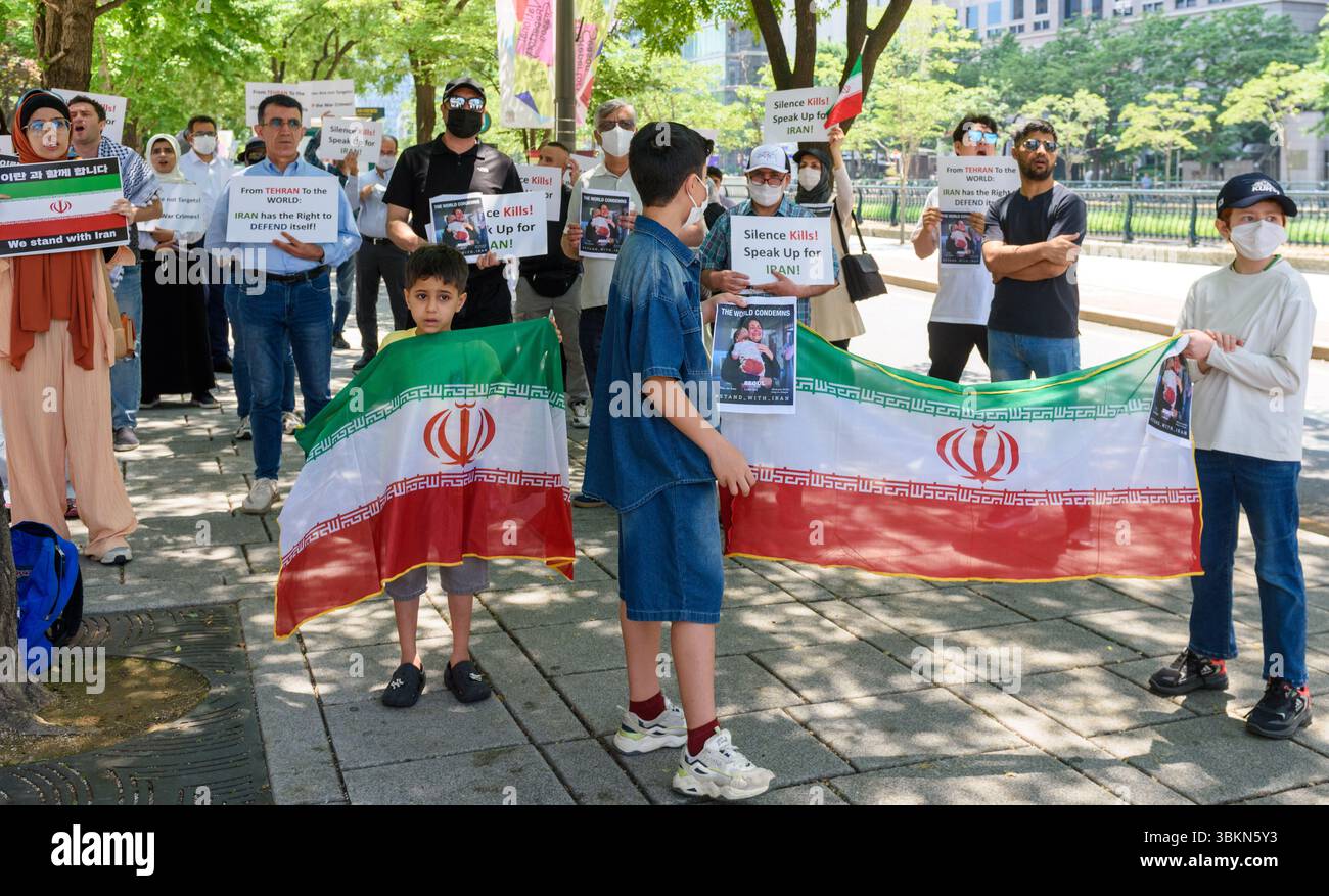 Seoul, South Korea. 22nd June, 2025. Iranians hold Iranian flags and ...