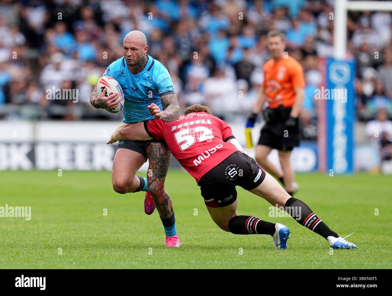 Hull's Zak Hardaker is atckled by Salford's Dan Russell during the ...