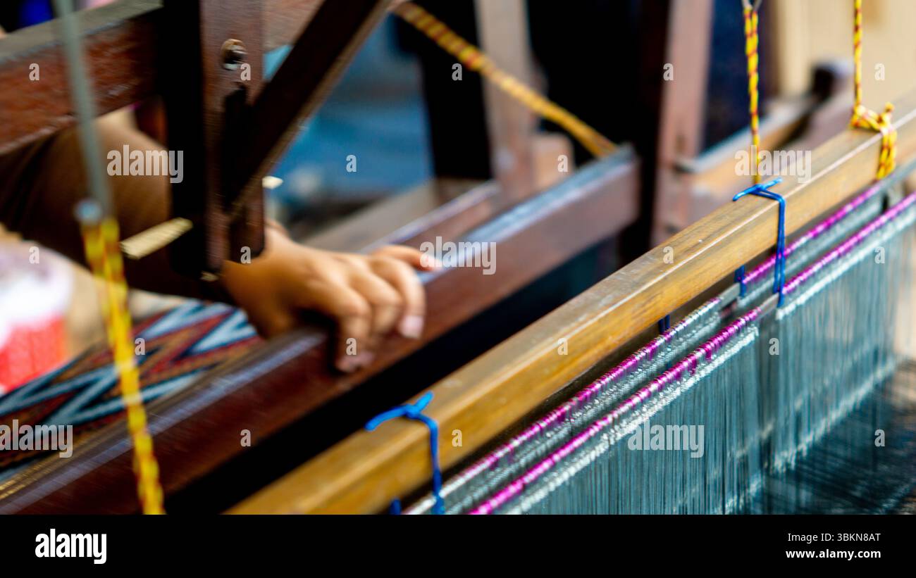 Making tenun ikat Bandar, Indonesia. An Indonesian woman weaving ...