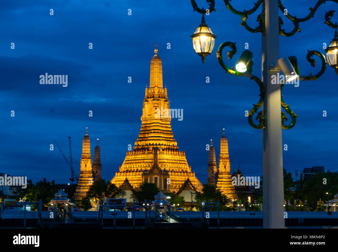 Wat Arun temple at night from across the Chao Phraya river Stock Photo ...