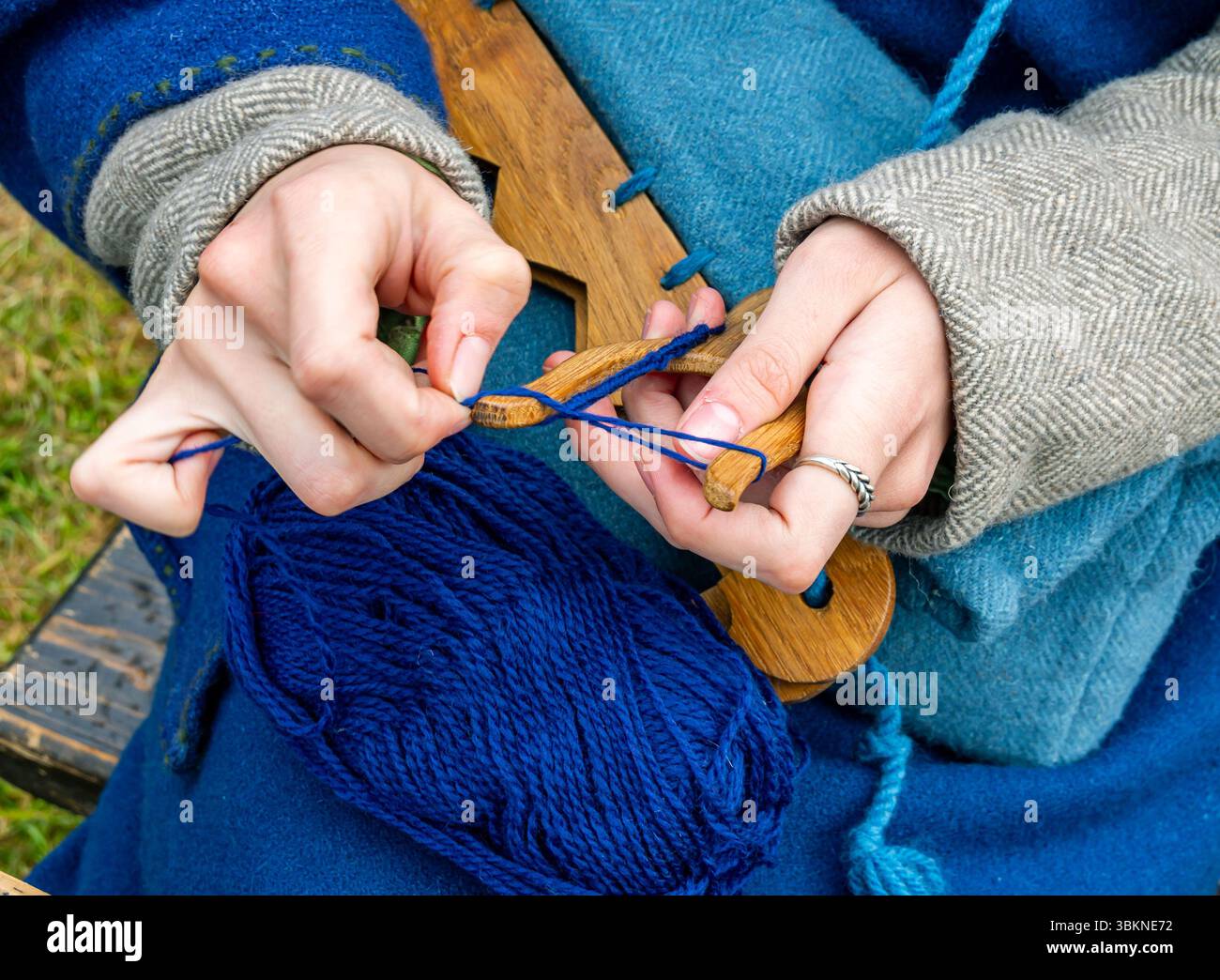 Weaving from threads using medieval technology Stock Photo - Alamy