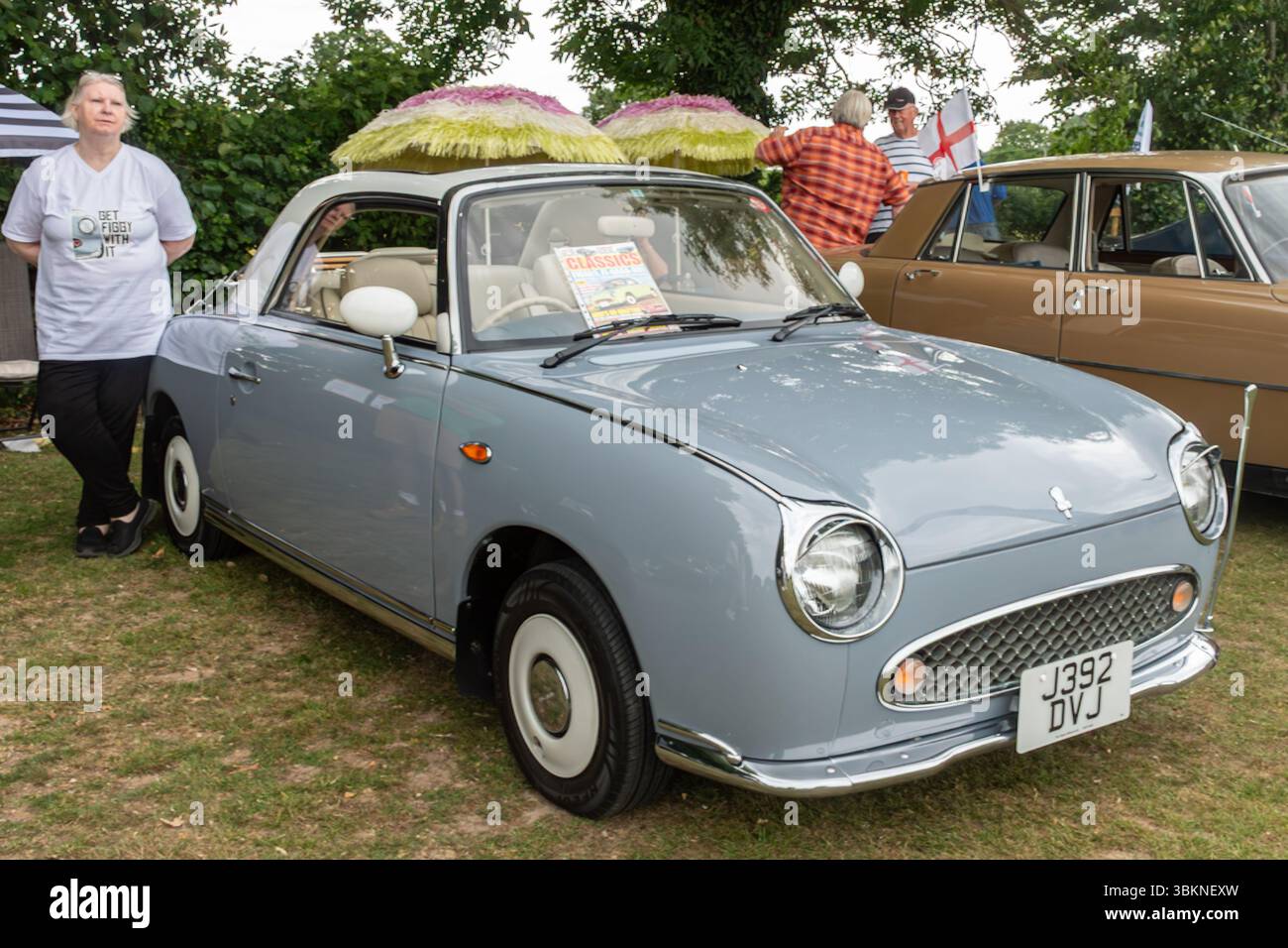 A grey Nissan Figaro car at a classic car show, England, UK Stock Photo ...