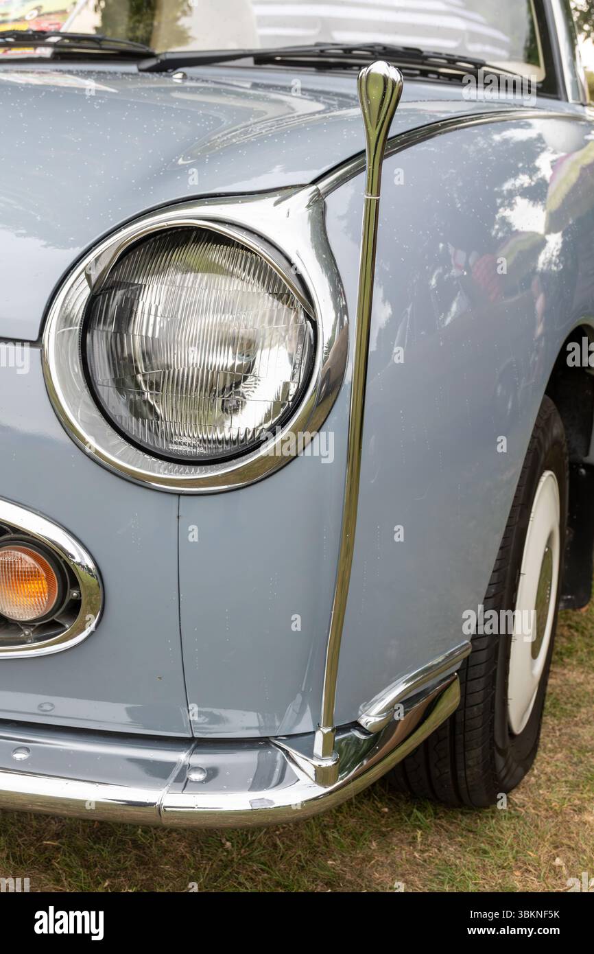 A parking stick on a grey Nissan Figaro car at a classic car show ...