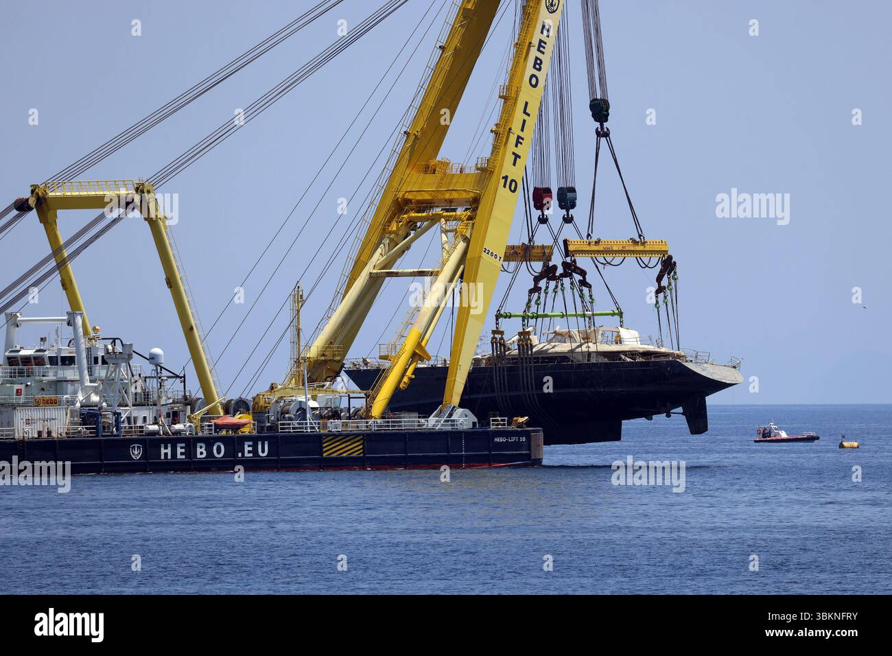 THE BAYESIAN LEAVES PORTICELLO WITH THE HEBO LIFT 10 BARGE AND IS TAKEN ...