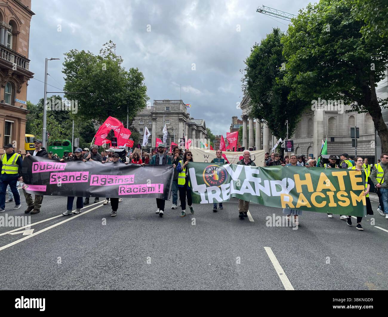 People take part in an anti-racism rally in Dublin, as a counter ...