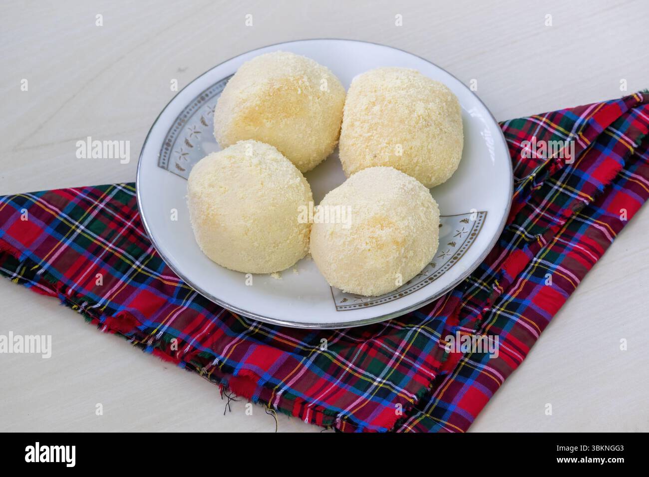 Popular Bengali Kachagolla sweets on a ceramic plate. This tasty treat ...