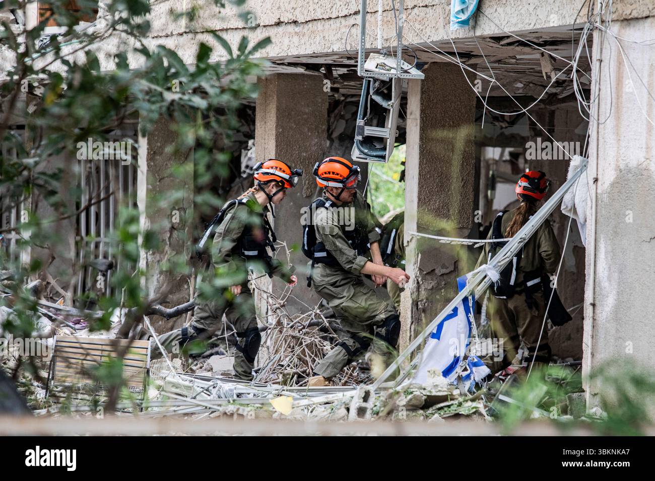 Israeli home front command first responders seen at an impact site ...